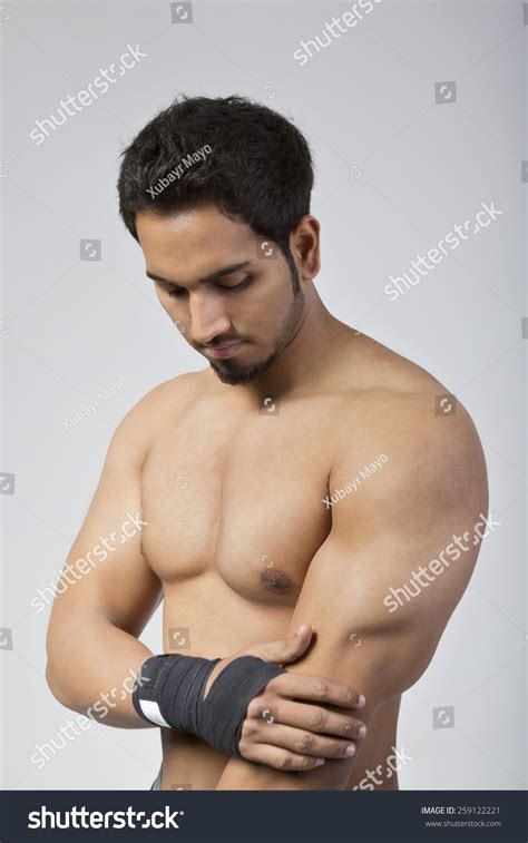 Muscular Sexy Man Flexing Biceps Stock Photo 259122221 Shutterstock