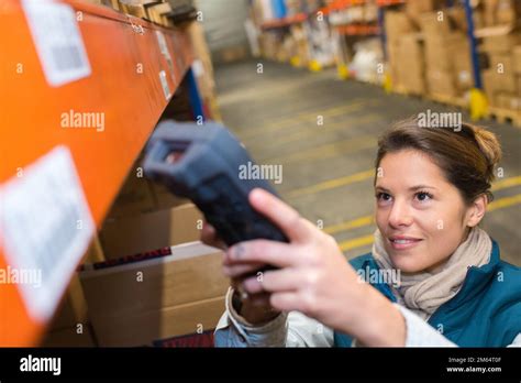 Female Worker Scanning Bar Code Of Packages Stock Photo Alamy