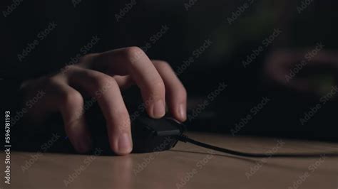 Close Up Of Man Gamer Hands Using Computer Mouse Is Playing Video Game