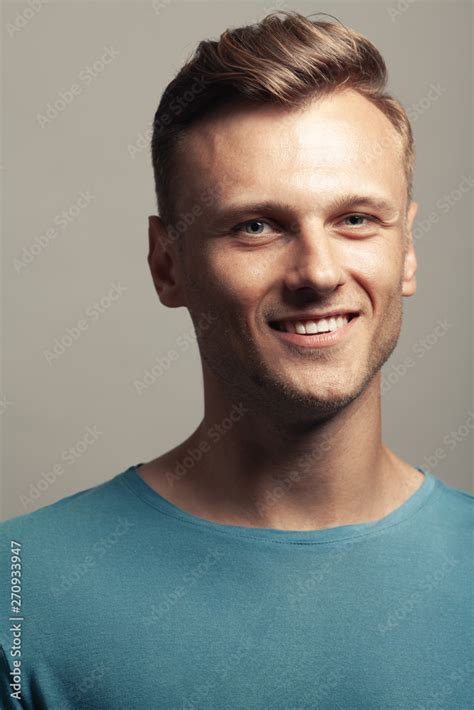 Fabulous At Any Age Portrait Of Handsome Year Old Man With Blue Eyes Standing Over Gray
