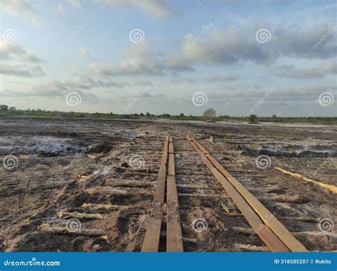 Making A Footbridge Using Wooden Slits For Four Wheeled Vehicles To