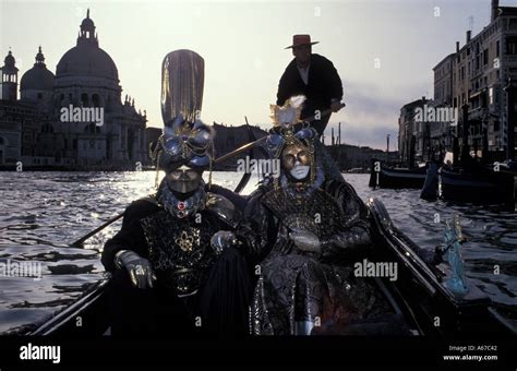Masks In Gondola On The Canale Grande Carnival In Venice Italy Stock