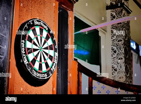 Blur Of Dart Flying Into Dart Board In Local Pub Stock Photo Alamy