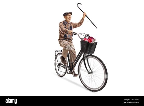 Full Length Shot Of A Cheerful Senior Man Riding A Bicycle And Raising