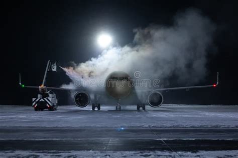 Ground Deicing Of A Passenger Aircraft On The Night Airport Apron At Winter Stock Image Image