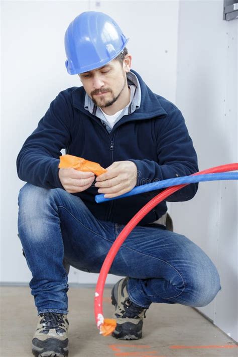 Builder Holding Cables Taped Together Stock Image Image Of Wire