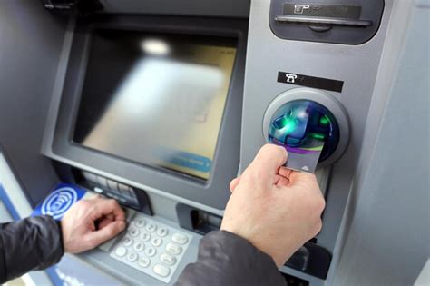 Premium Photo A Man Making A Transaction With A Credit Card At An Atm Automated Teller Machine