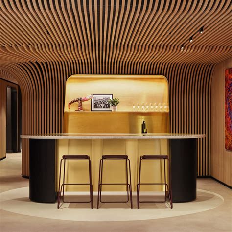 Steam Bent Timber Tunnels Through Sculptform Showroom By Woods Bagot