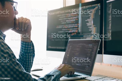 Man Programmers Are Stressed And Hand Holding Nose With Headache At The