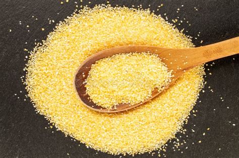 Uncooked Corn Grits In A Ceramic Dish Macro Top View Stock Image
