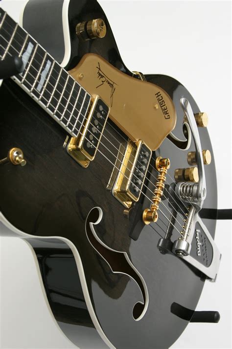 Black electric guitar with gold hardware Free Stock Photo | FreeImages