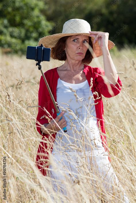 Mature Selfie Concept Focused Mature Woman Learning How To Take A