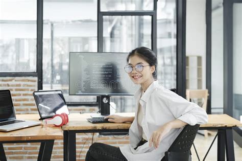 Young Programmer Working On Desktop Pc In Office Of Software Company