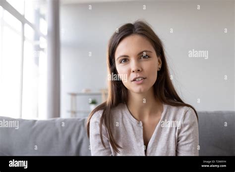 Headshot Woman Looking At Camera Having Conversation Using Computer