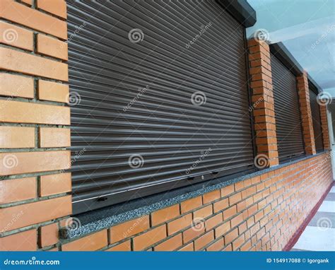 Windows With Rolling Shutter On The Wooden House Facade Exterior Stock