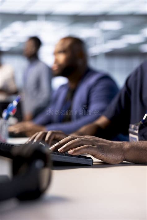 Data Center Worker Typing On Keyboard Using Programming Languages