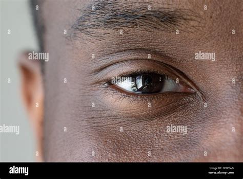Close Up Of An African Mans Face Eye Macro With Black Iris Close Up