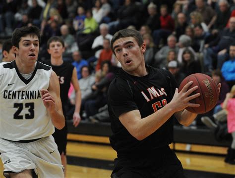 Ames Joe Evans Drives To The Basket Around Ankeny Centennials