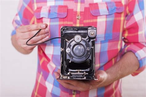 Premium Photo Man With Retro Camera