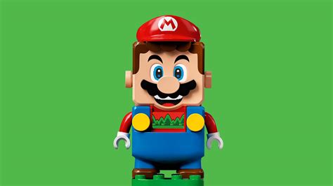 A Clipart Image Of A LEGO Mario Character With A Red Hat And Blue Overalls Against A Green