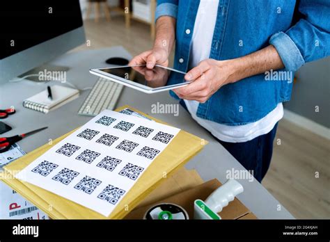 Businessman Scanning QR Codes At Office Stock Photo Alamy