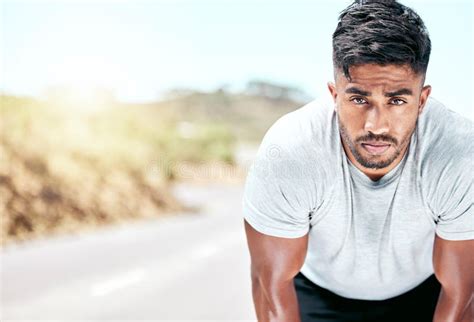 Fit Young Mixed Race Man Resting While Exercising Outdoors Handsome Hispanic Male Athlete