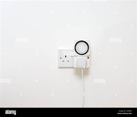 Mechanical Plugin Mini Timer Swich Plugged Into A Wall Socket Stock Photo Alamy