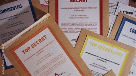 Top Secret Files In Brown Manila Folders With Warning Cover Sheets On Desk Different Types Of