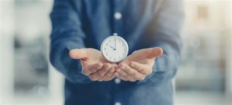 Businessman Holding Stopwatch In Hands Representing Time Management And Efficiency Premium Ai