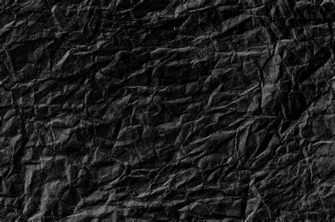 구겨진 검은 종이 질감 배경 프리미엄 사진