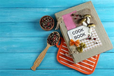 Premium Photo Decorated Cookbook On Blue Wooden Background Premium Photo Decorated Cookbook On Blue Wooden Background