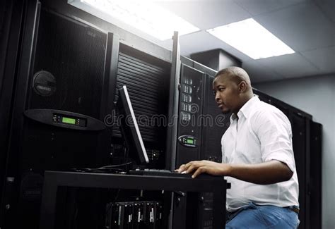 It Support Black Man Or Coding On Laptop In Server Room For Big Data Network Glitch Or Digital