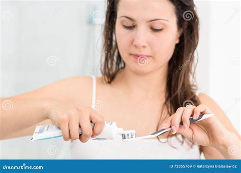 Woman Squeezing Toothpaste Stock Image Image Of Freshness 72355769