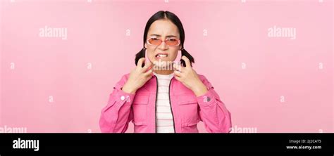 Image Of Angry Pissed Off Korean Adult Female Model Shaking Fists And