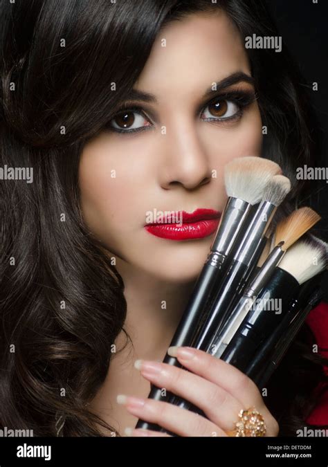 Portrait Of Attractive Woman With Brunette Hair Dark Studio Shot