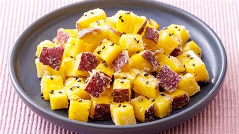 A Black Bowl Filled With Chopped Pineapple And Other Food Items On Top