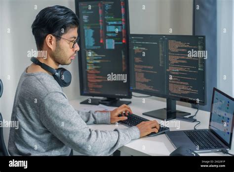 Asian Man Prompt Engineer Develop Coding App With Software Data Sitting