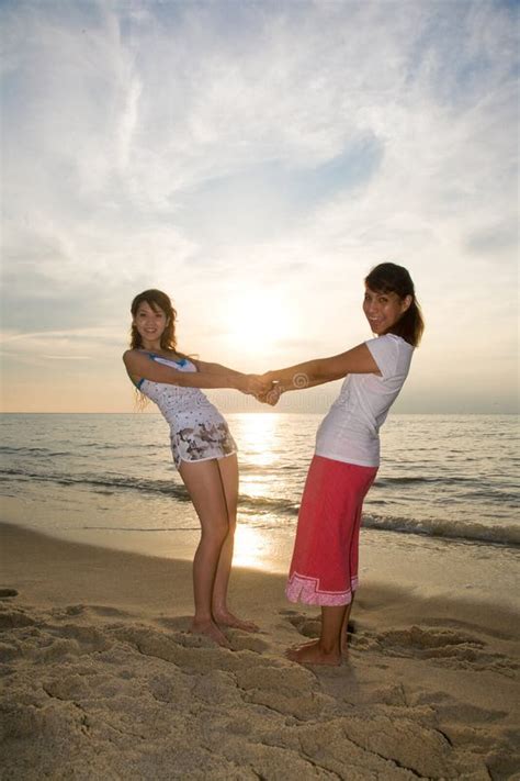 Two Girls Having Fun At The Beach Stock Image Image Of Meditation Healthy