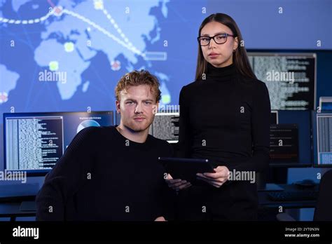 Professional Serious Cyber Security Team In Front Of Cybersecurity Siem System With Logs And