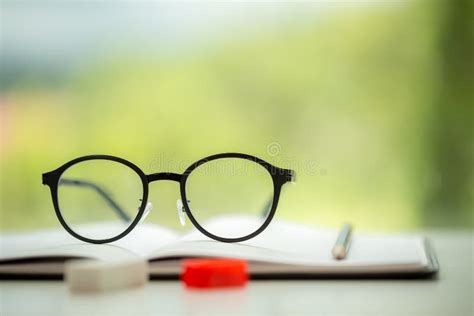 Object Education Green Nature Background With Stack Of Ancient Books Or Old Bible Open Paper