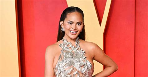 Chrissy Teigen Embraces Her ‘boob Lift Scars In Sheer Dress Us Weekly