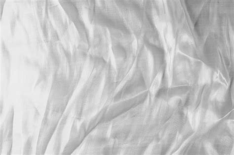 배경 질감 패턴입니다 직물은 흰색입니다 우아하고 섬세 한 화이트 실크 직물 배경입니다 밝은 공단 직물 배경으로 사용 하기 위해