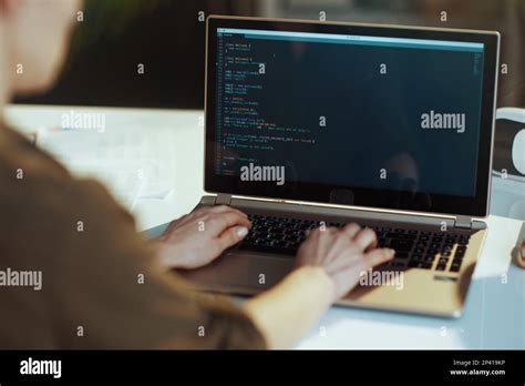 Seen From Behind Modern Female With Laptop Working On Cyber Security Firewall Protection In