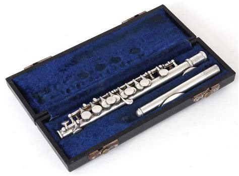 Lot 719 A Silver Plated Metal Cased Piccolo By