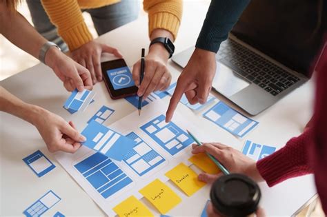 Premium Photo Group Of Ux Developer And Ui Designer Brainstorming About App Interface Design