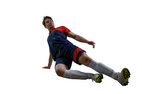 Football Player Slides To Hinder The Opponent Soccer Player During The