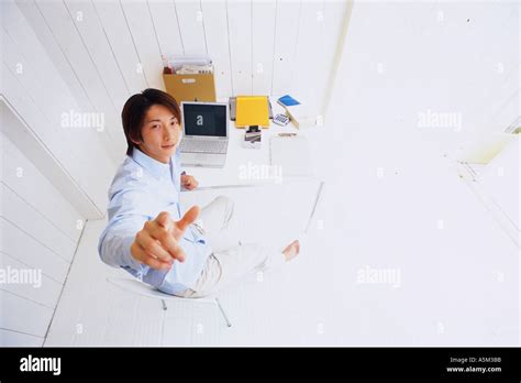 Asian Man Pointing Up Stock Photo Alamy