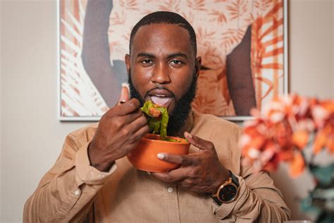 A Man Holding A Bowl Of Food In His Hands Photo Free Food Image On