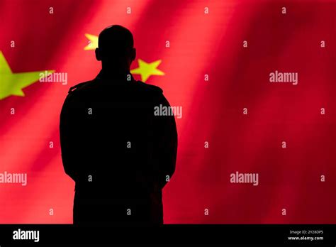 Ccp Government Agent Standing Proud In Front Of Chinese Flag Feeling Pride In Serving Country