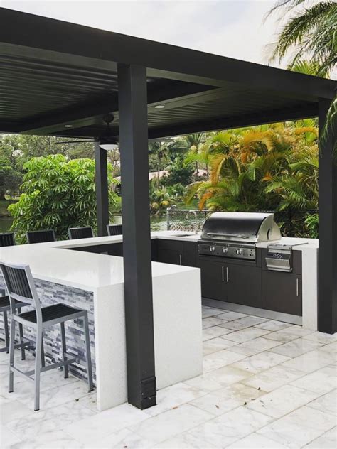 Luxury Outdoor Kitchen With Grill And Seating Area